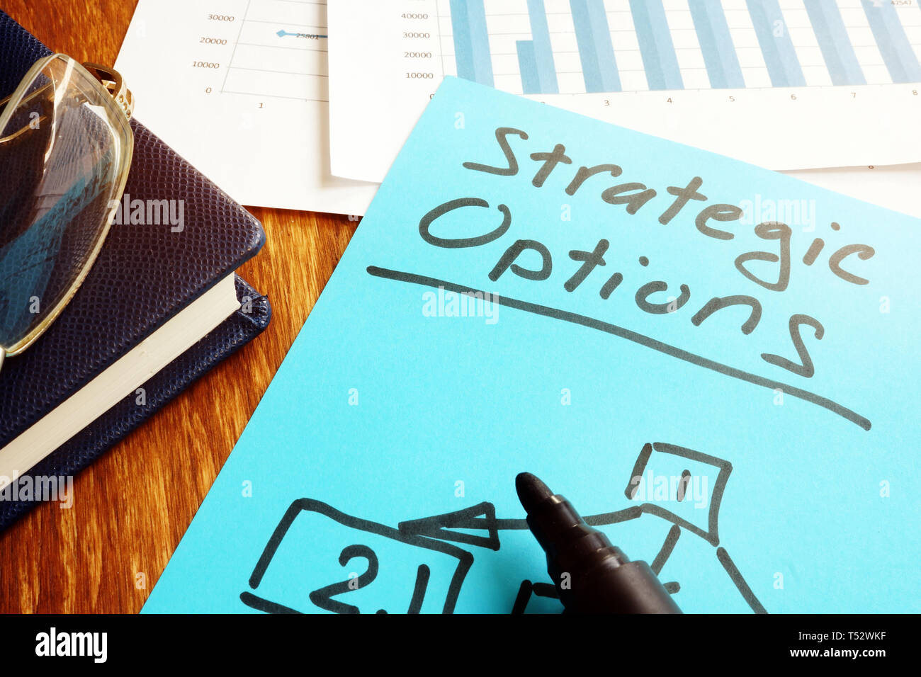 Strategic Options concept. Papers with plan and business documents ...