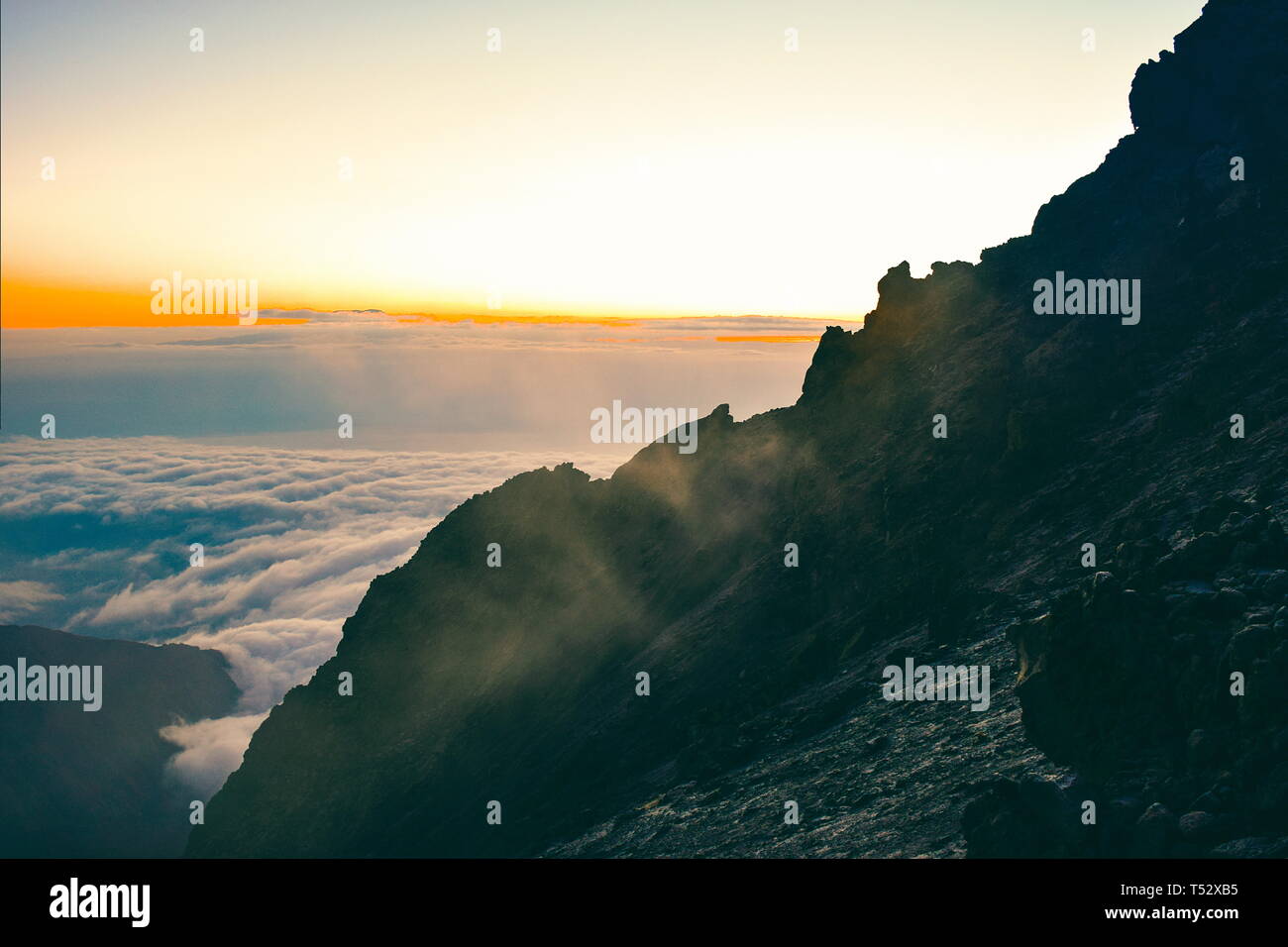 Sunrise above the clouds at Mount Meru, Tanzania Stock Photo - Alamy