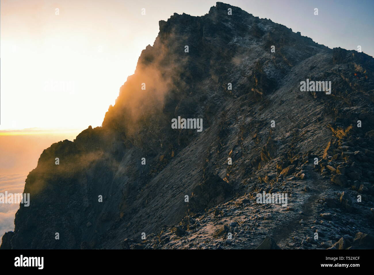 Sunrise above the clouds at Mount Meru, Tanzania Stock Photo - Alamy
