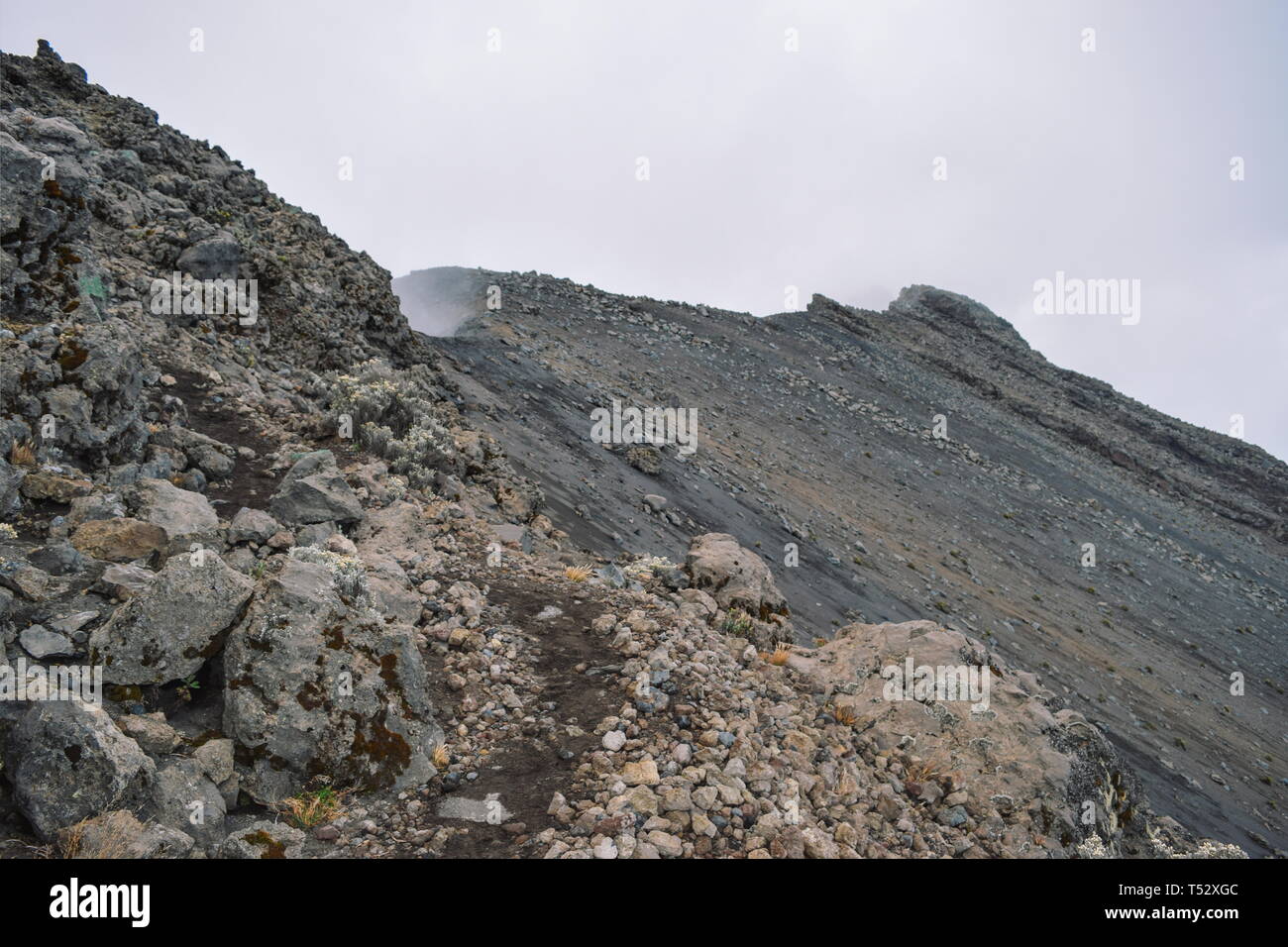 Rock formations above the clouds at Mount Meru, Tanzania Stock Photo ...