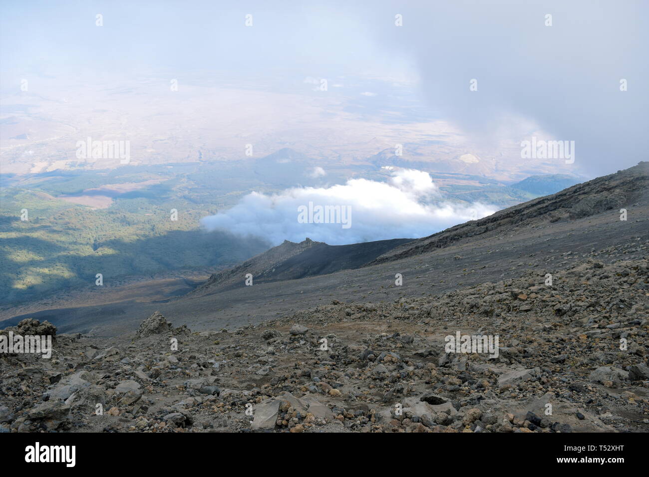 Rock formations above the clouds at Mount Meru, Tanzania Stock Photo ...