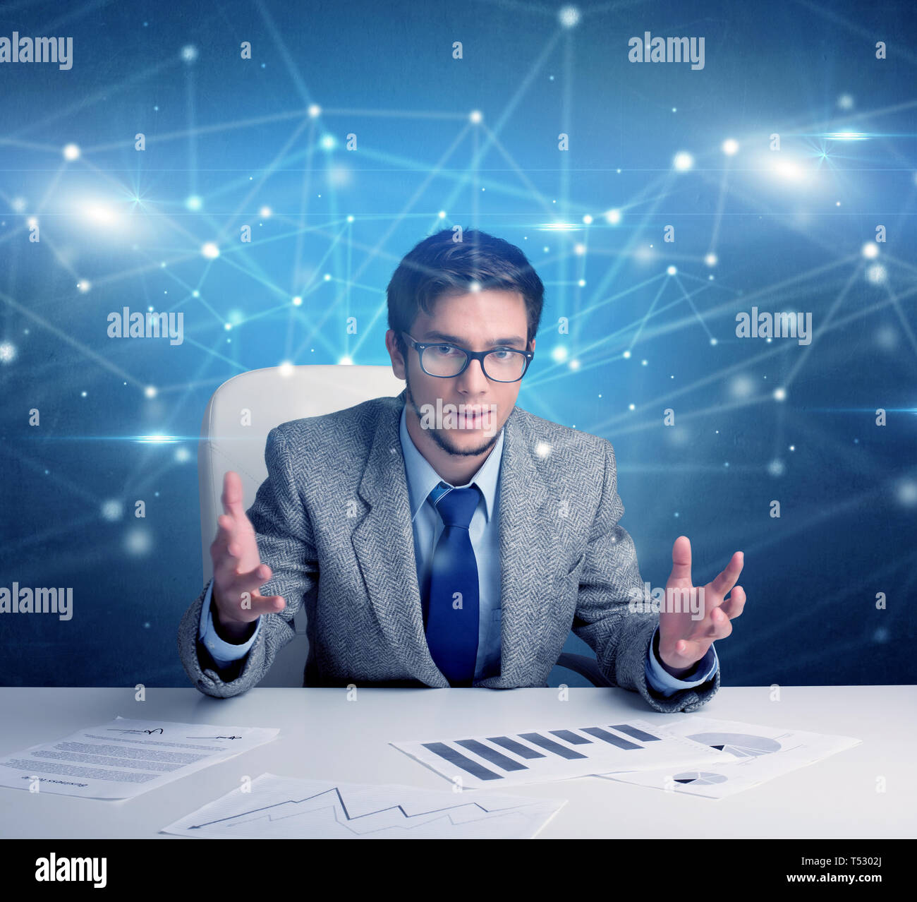 Manager in front of the office desk with networking concept Stock Photo ...