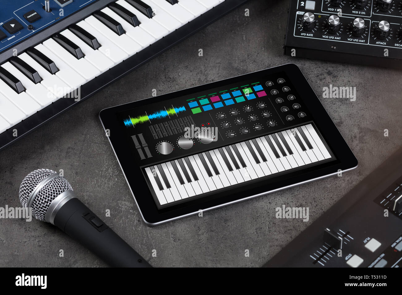 Piano synthesizer app on tablet and musical instrument concept Stock Photo - Alamy