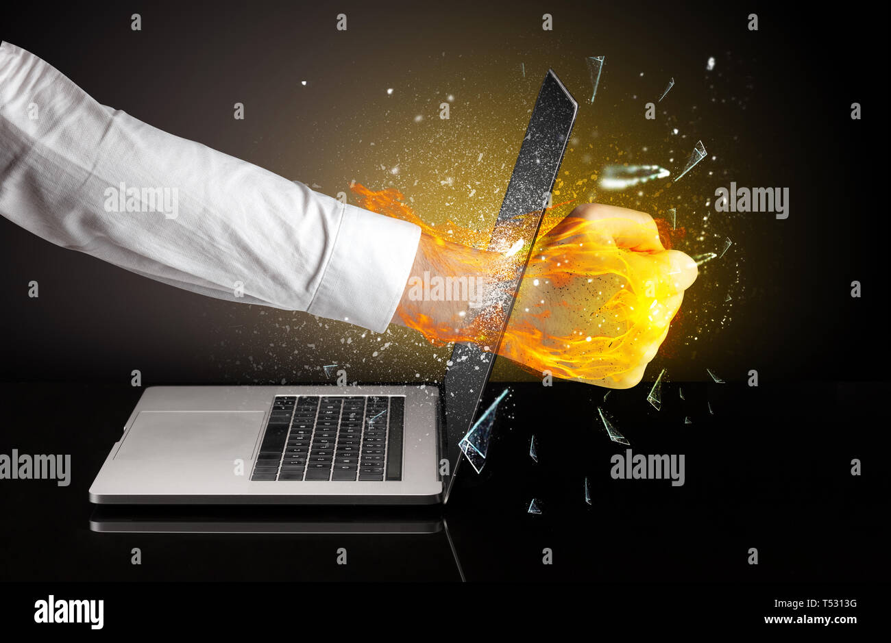 Firing hand hitting strongly laptop screen glass Stock Photo - Alamy
