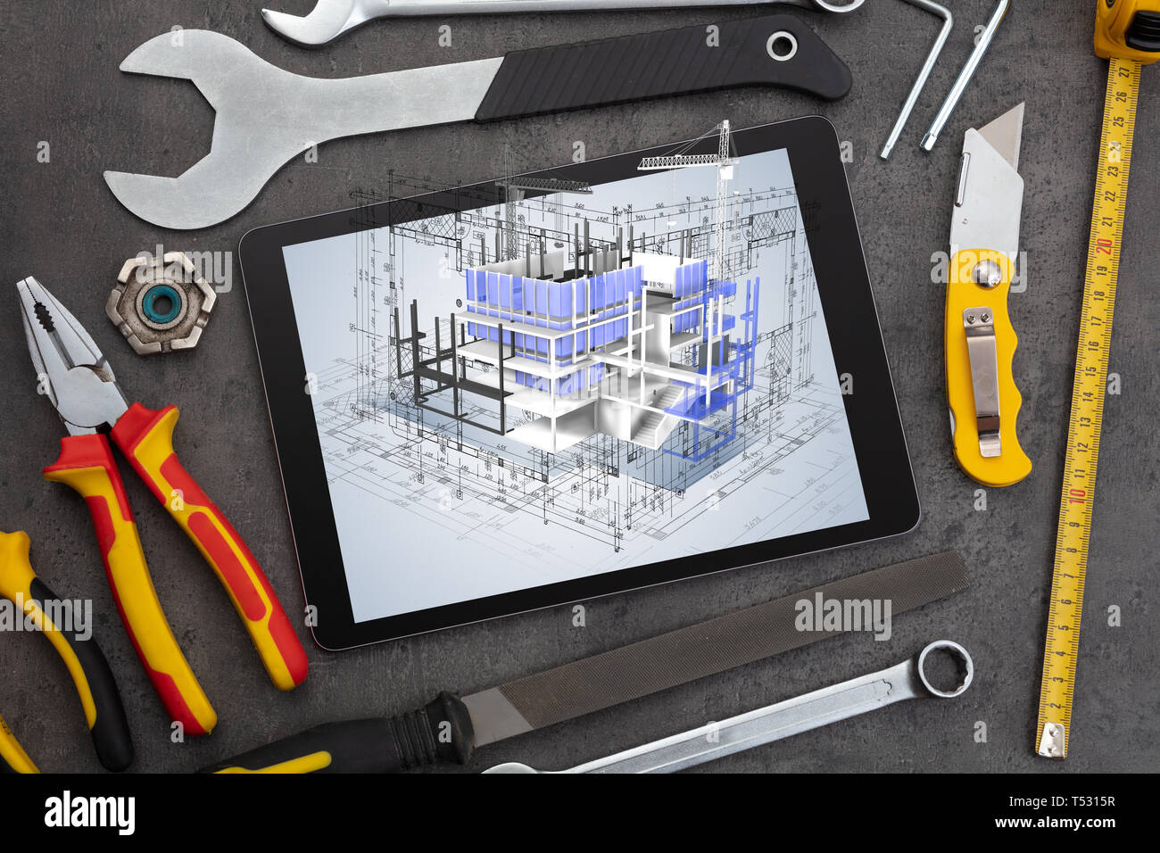 Tablet with construction tools and 3d house plan concept Stock Photo ...