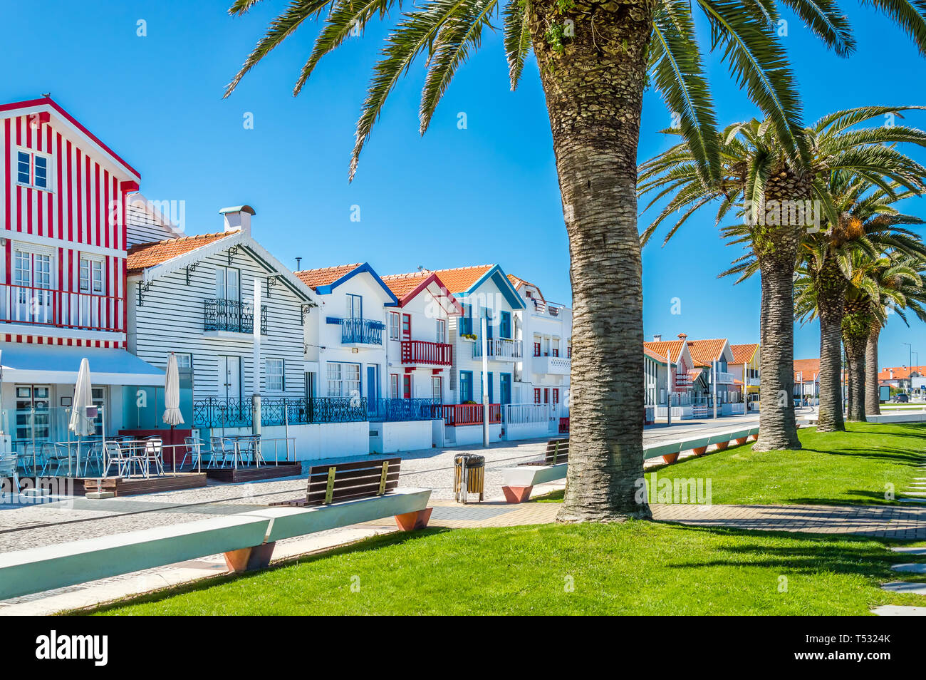 Costa Nova, Portugal: colorful striped houses called Palheiros with red ...