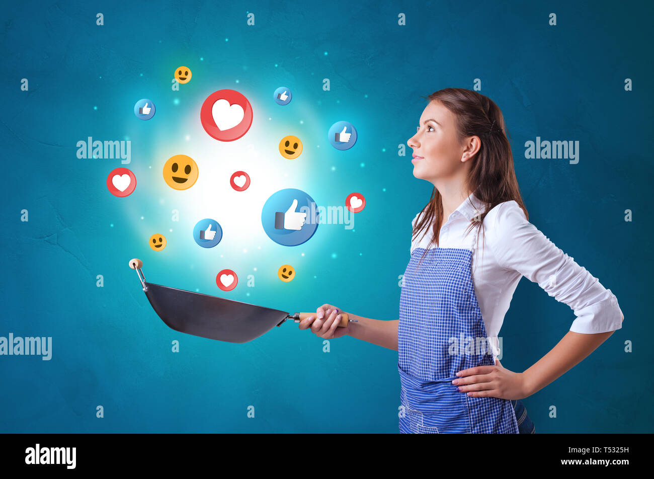 Young happy person cooking social media concept in wok Stock Photo - Alamy