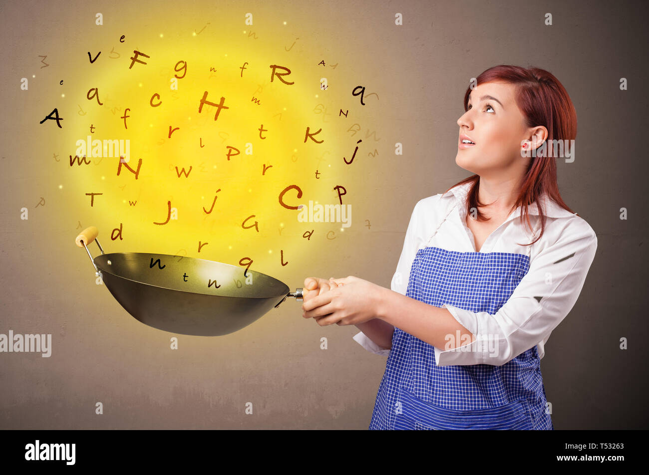 Young person cooking letters in wok Stock Photo - Alamy