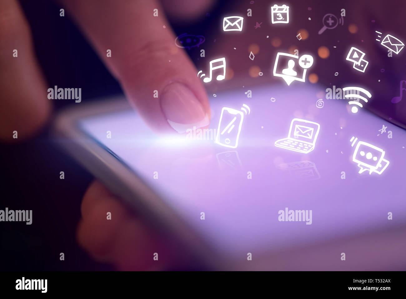 Finger touching phone with hologram application icons and dark ...