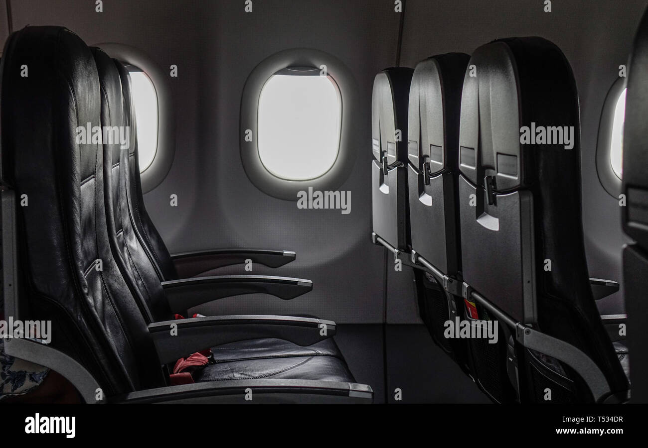 Empty airplane with black chairs. Concept for travel, transportation ...