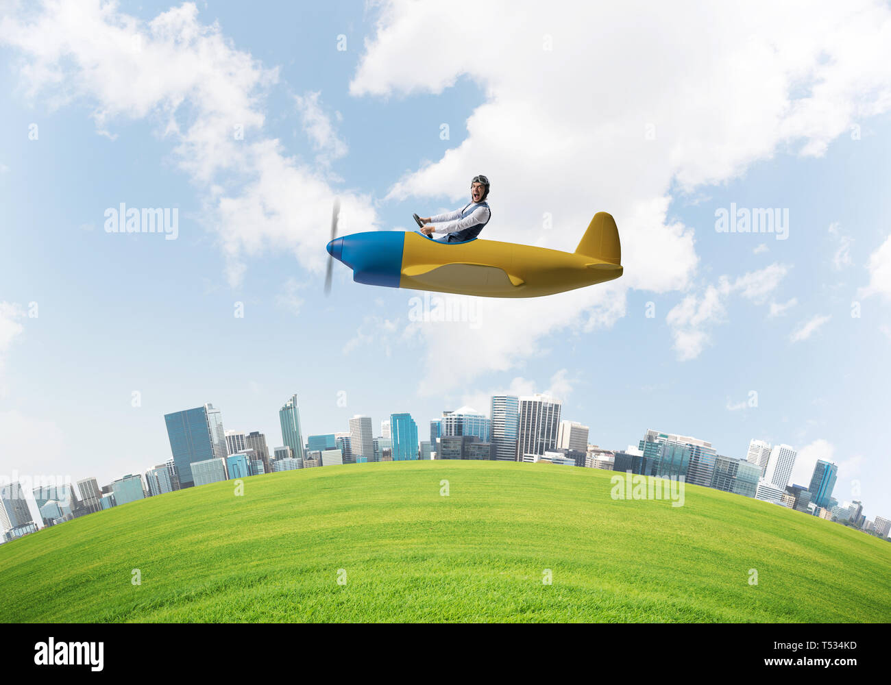 Screaming businessman in leather helmet flying Stock Photo - Alamy