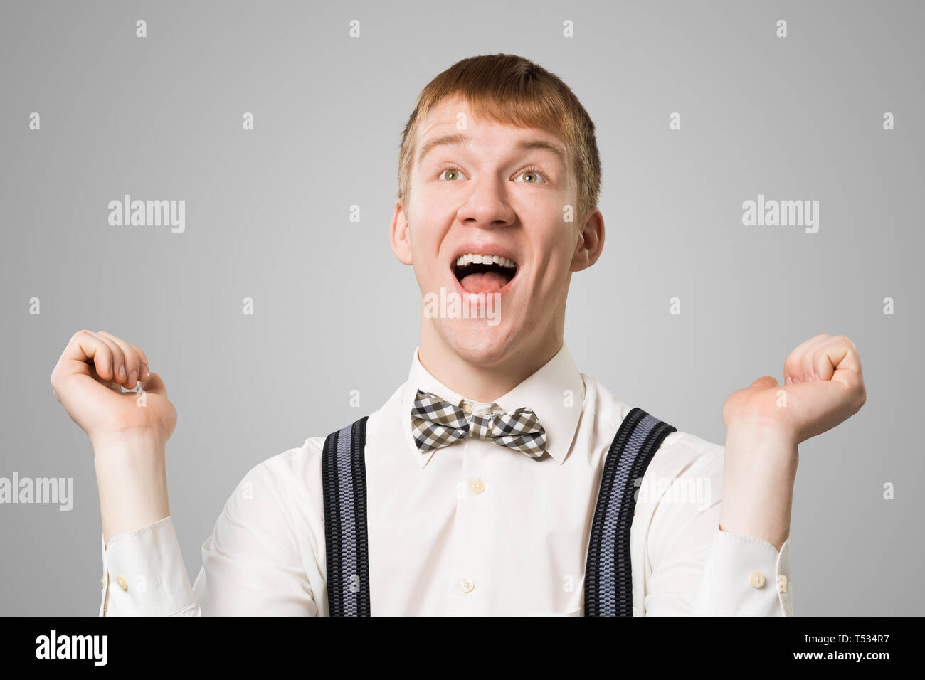 Hipster smiling broadly with satisfied look Stock Photo - Alamy