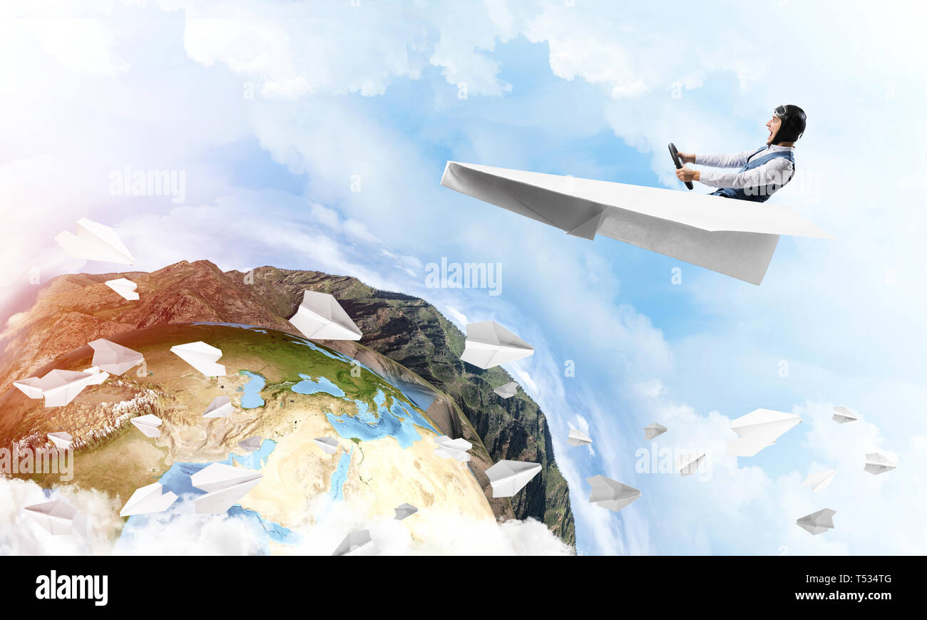 Pilot in leather helmet driving paper plane Stock Photo - Alamy