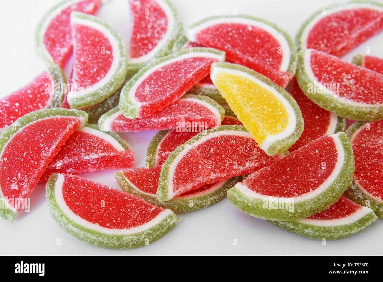 Sweet marmalade in the form of slices of watermelon and lime lies on ...