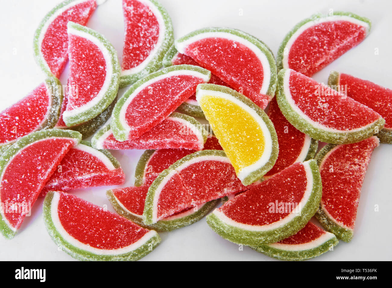 Sweet marmalade in the form of slices of watermelon and lime lies on a ...