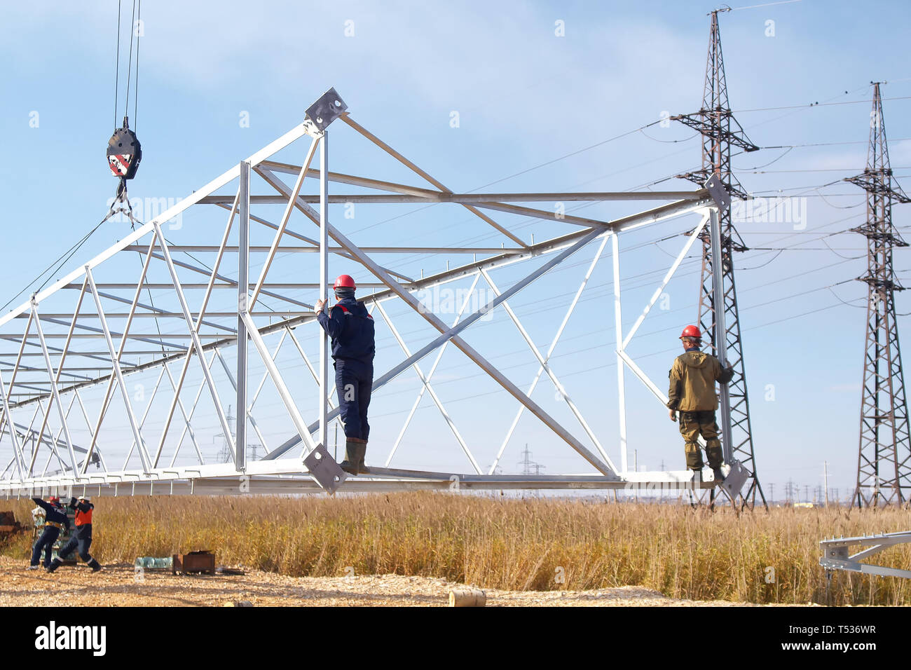 The process of installing supports for power lines in the suburbs ...