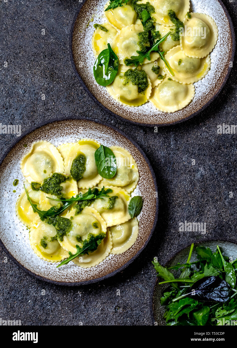 Italian spinach ricotta ravioli, Top view, black background, copy space ...
