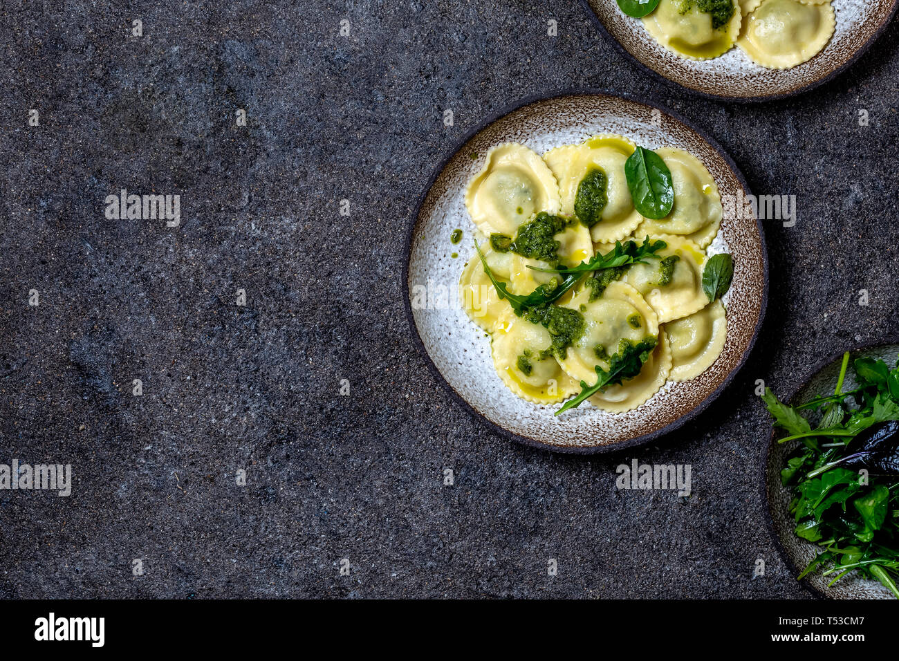 Italian spinach ricotta ravioli, Top view, black background, copy space ...
