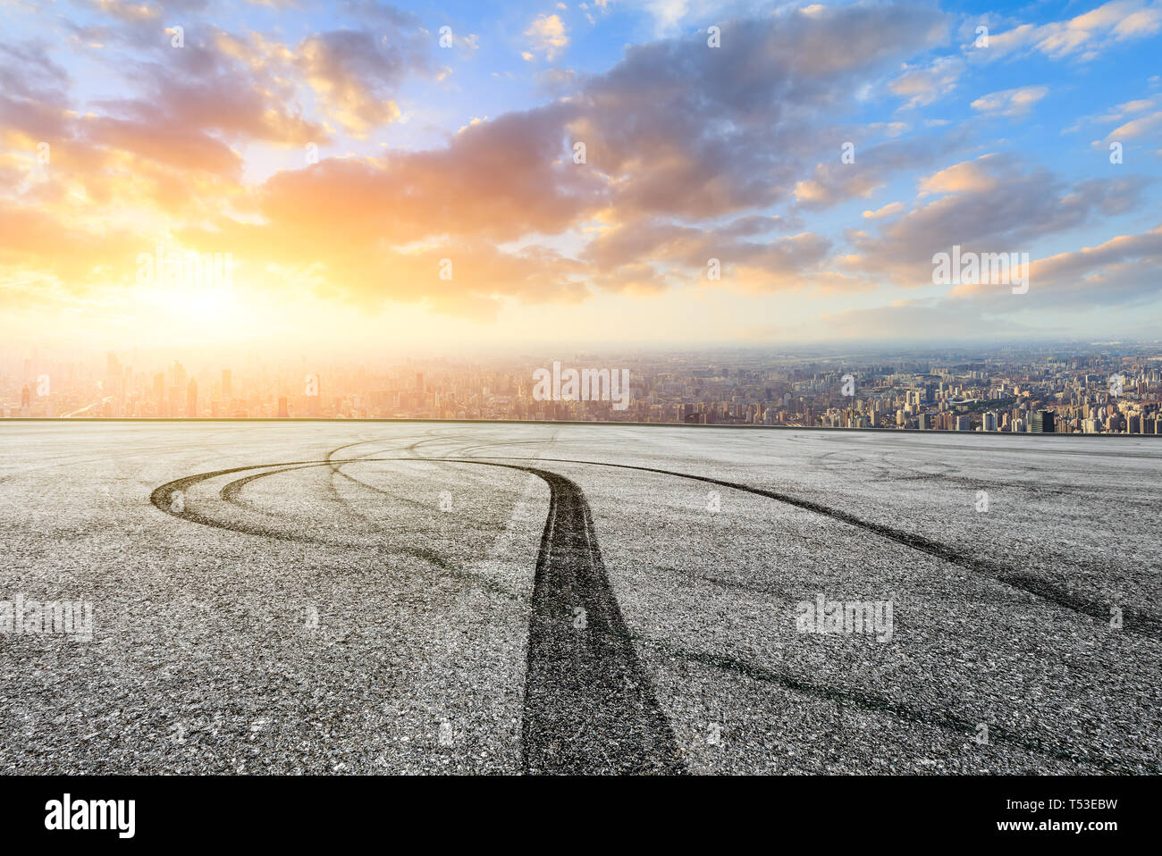Shanghai city skyline and asphalt race track ground at sunrise,high ...