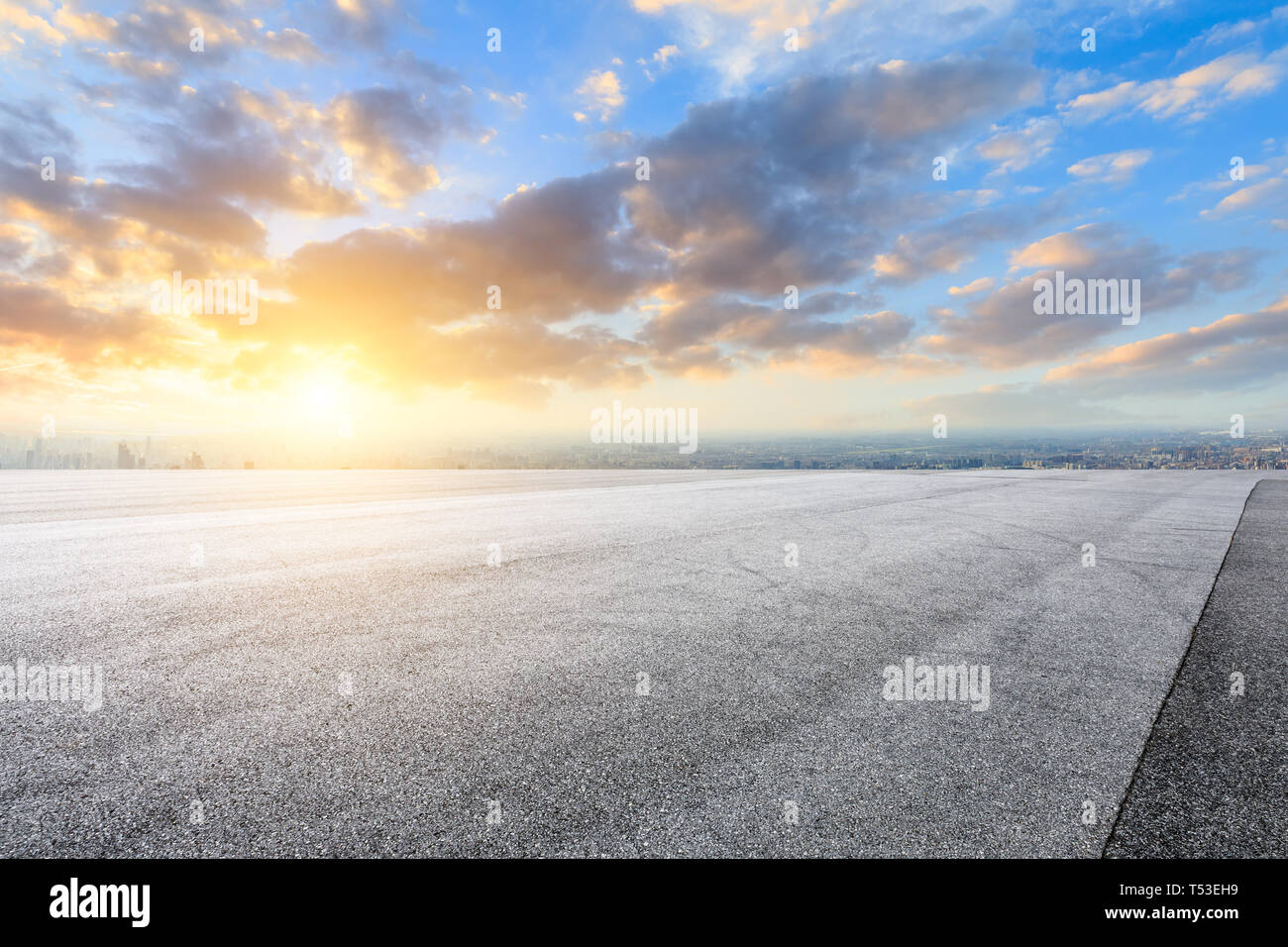 Shanghai city skyline and asphalt race track ground at sunrise,high ...