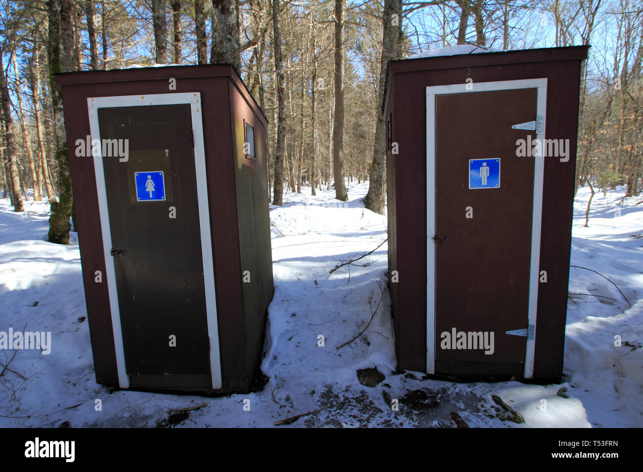 Two outhouses in the snow Stock Photo - Alamy