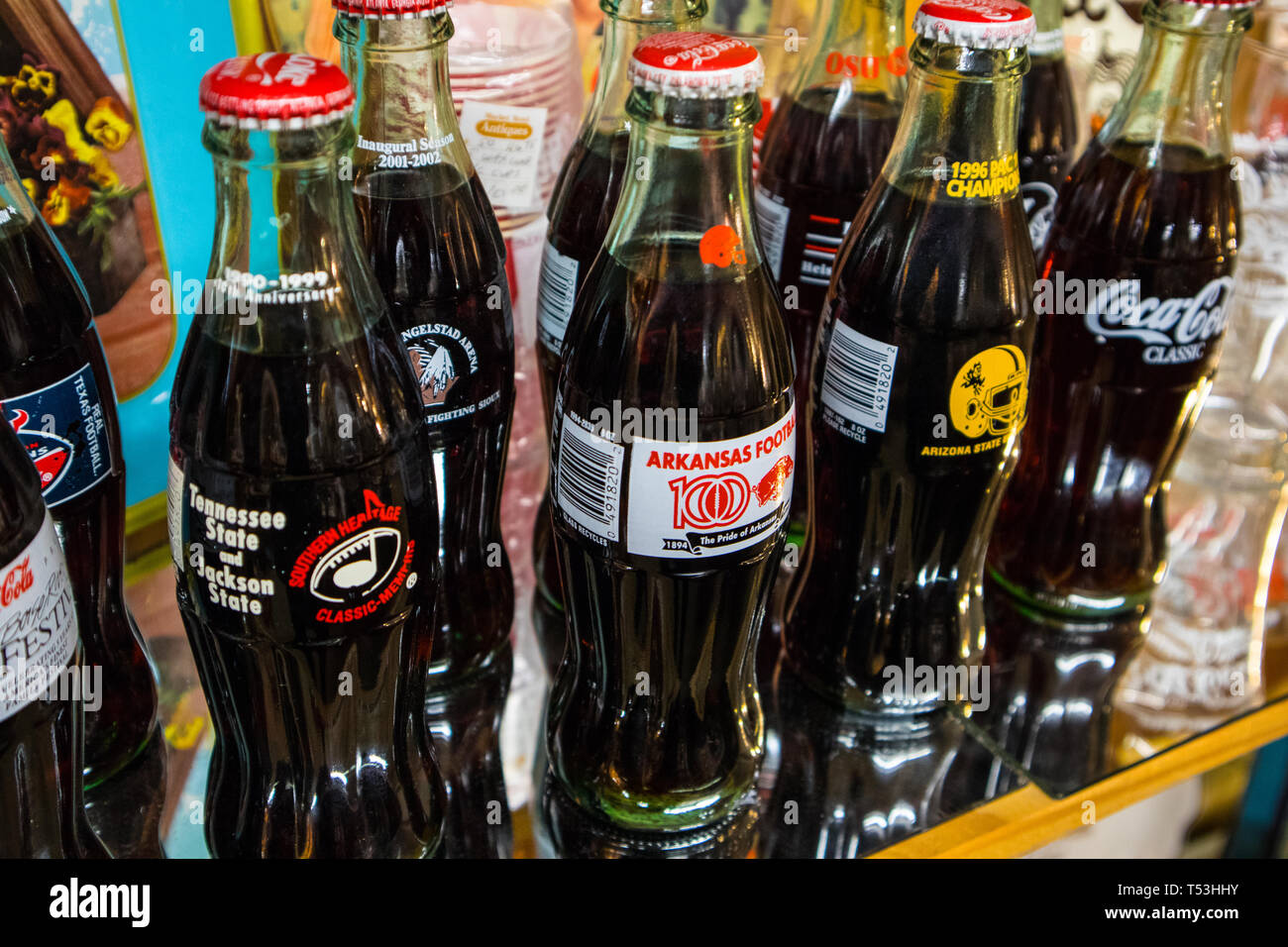 A variety of unopened anniversary Coke bottles, from different US ...