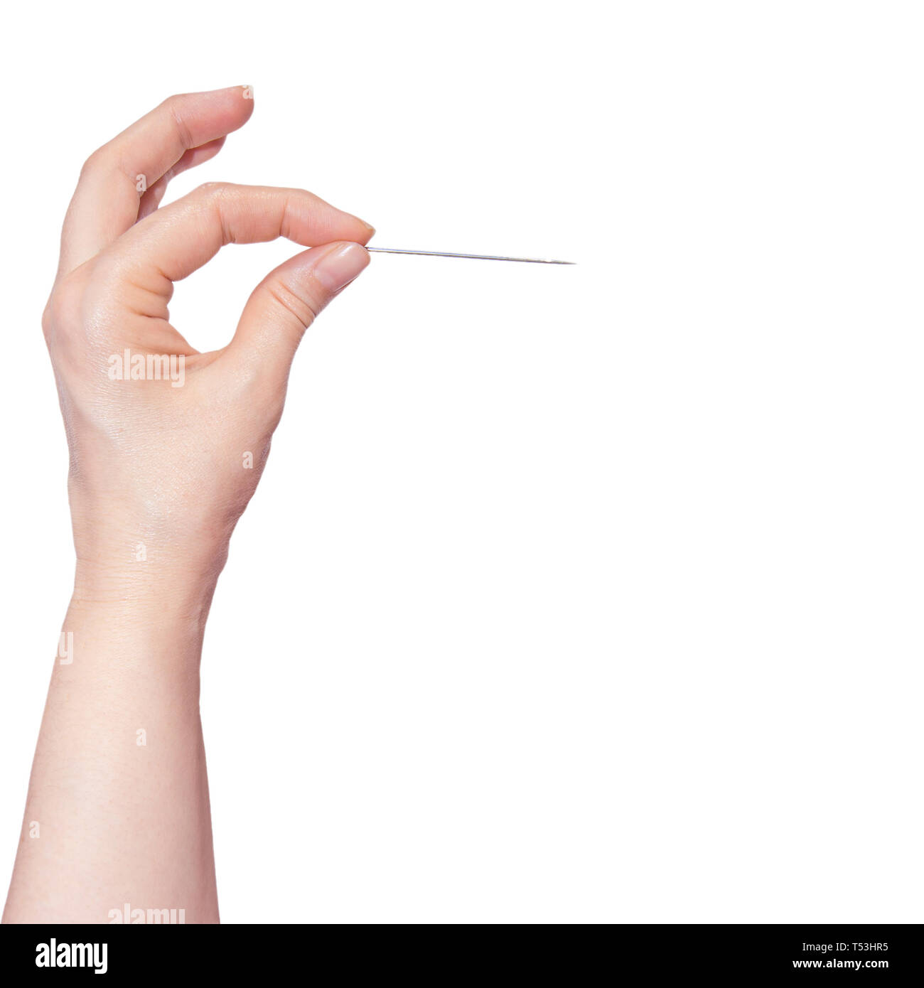 Woman's hand holding a needle on white background Stock Photo - Alamy