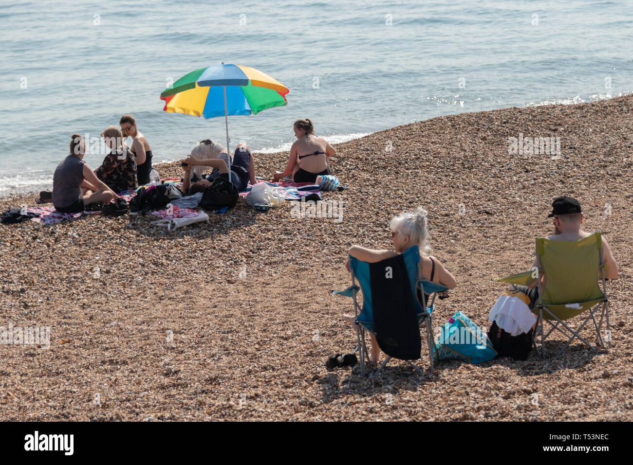 A group of people sunbathing on the beach during the bank holiday sun ...