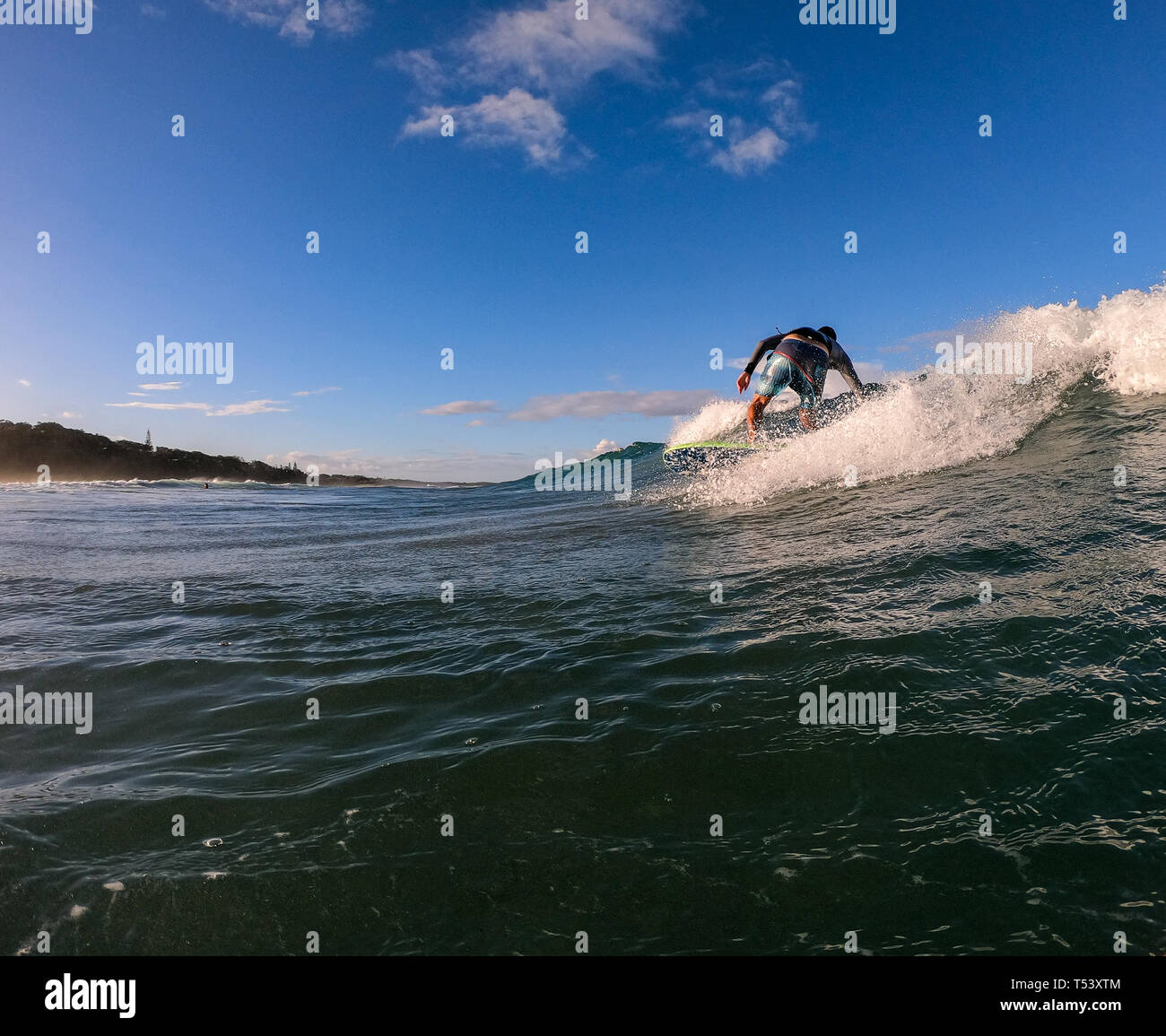 surfer riding a wave Stock Photo - Alamy