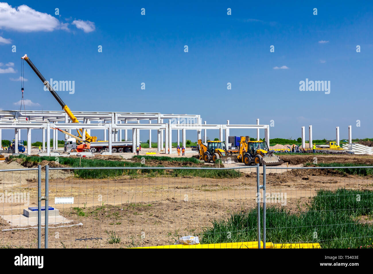 Landscape transform into urban area with machinery, people are working ...