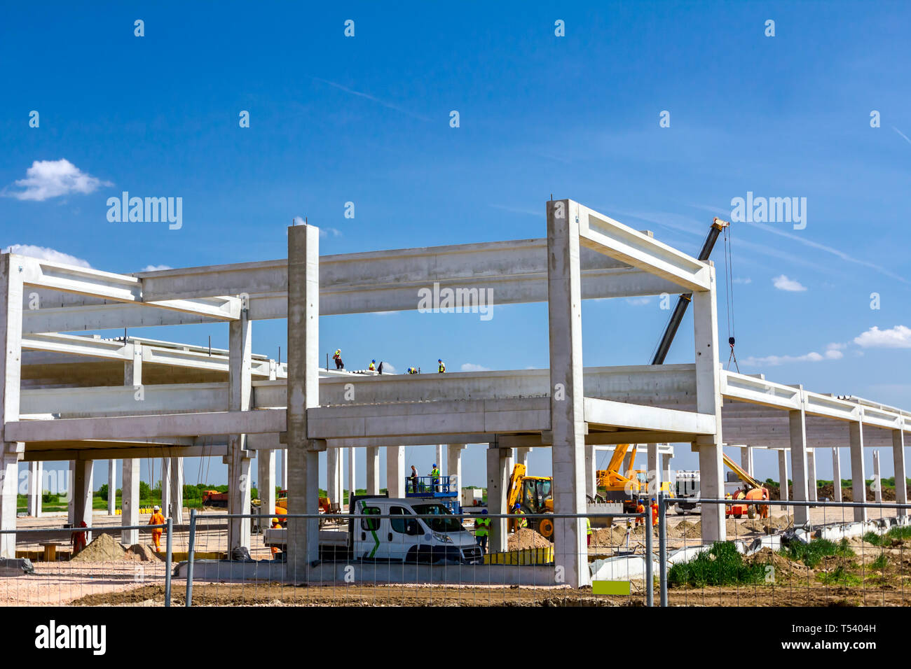 Landscape transform into urban area with machinery, people are working ...