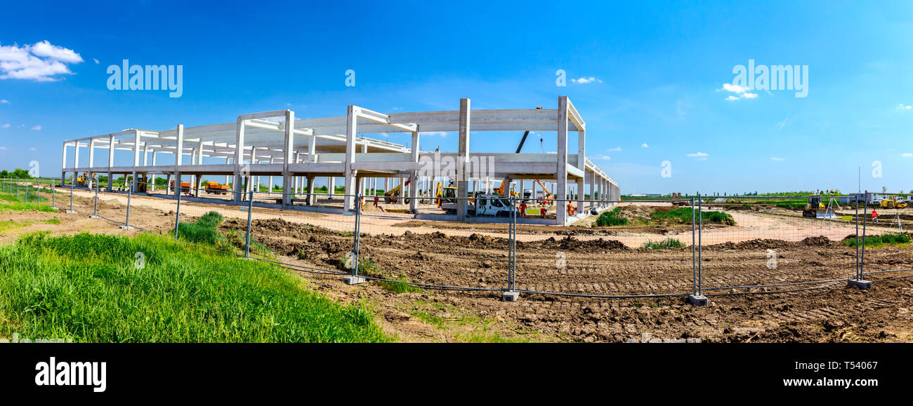 Panorama is taken with wide lens, unfinished concrete edifice under ...