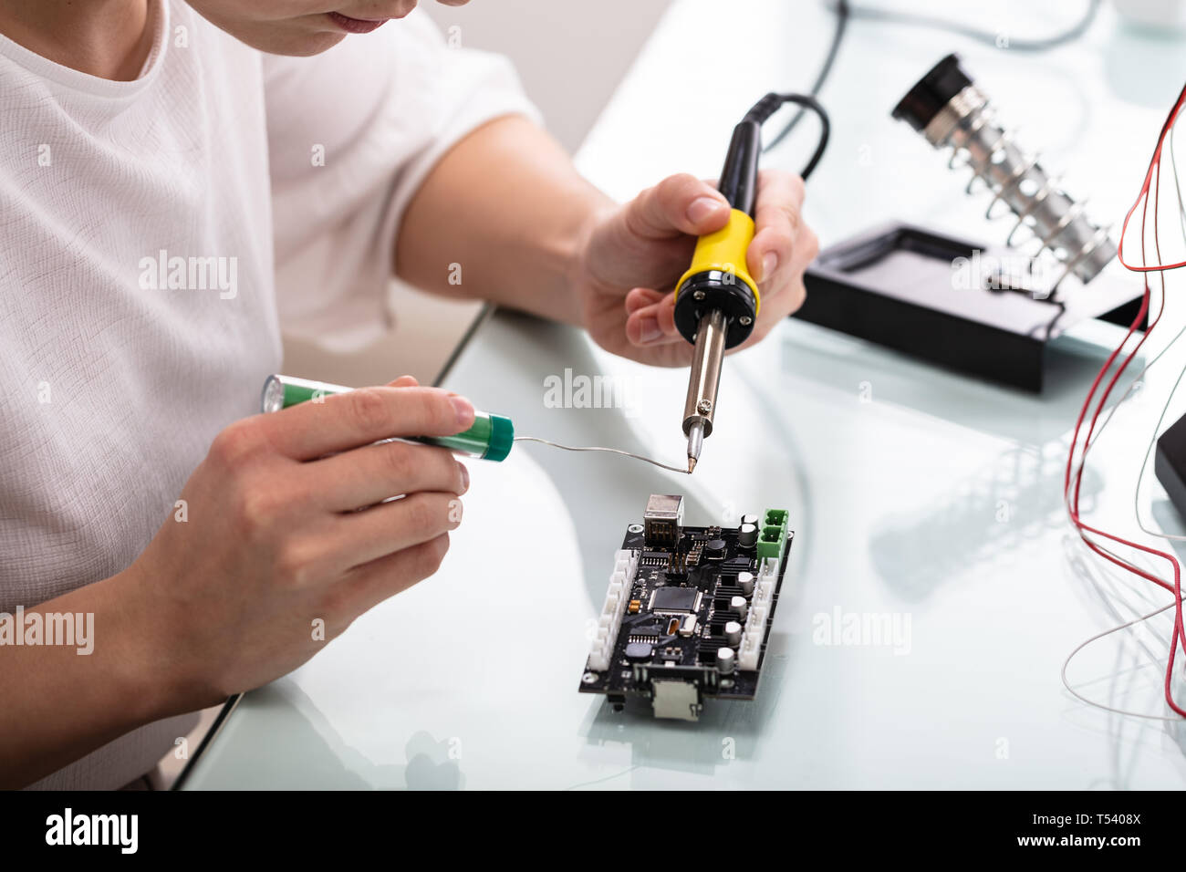 Human hand holding soldering iron hi-res stock photography and images ...
