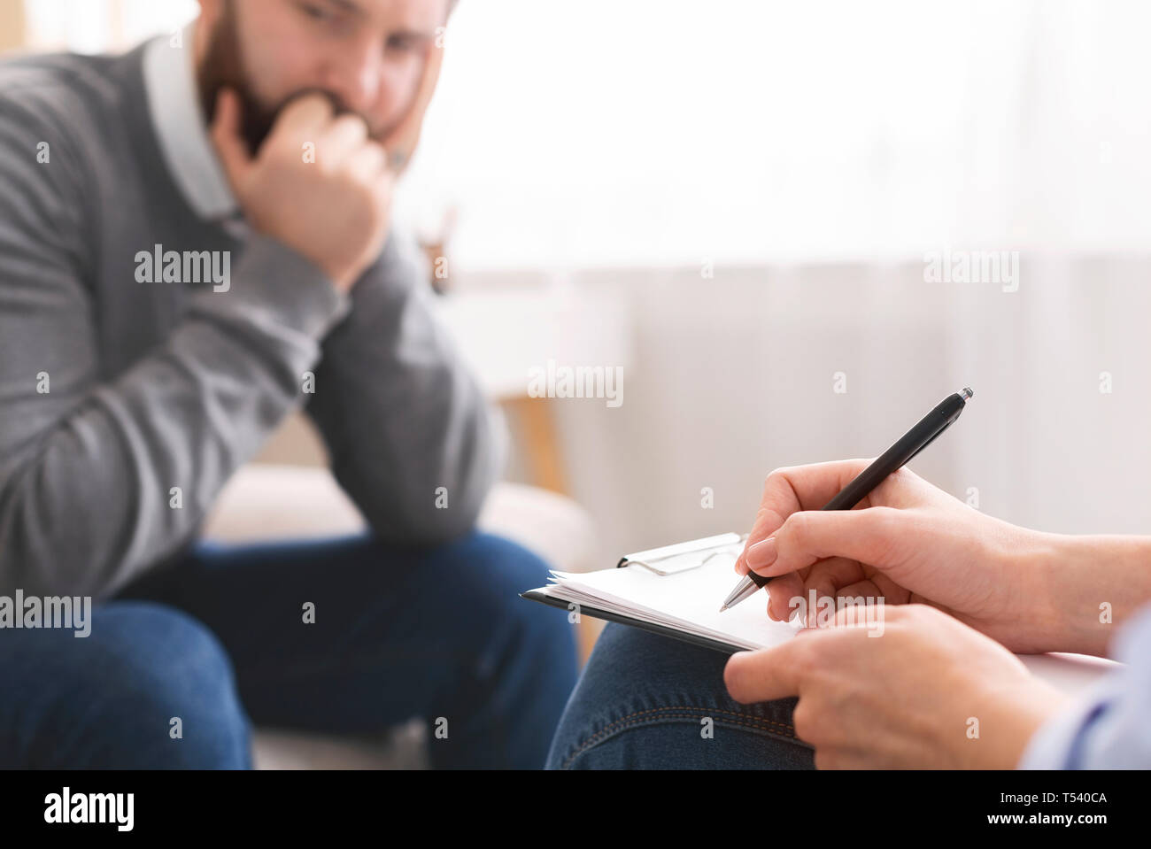 Doctors notes. Pen in hands of smart professional psychologist, being ...