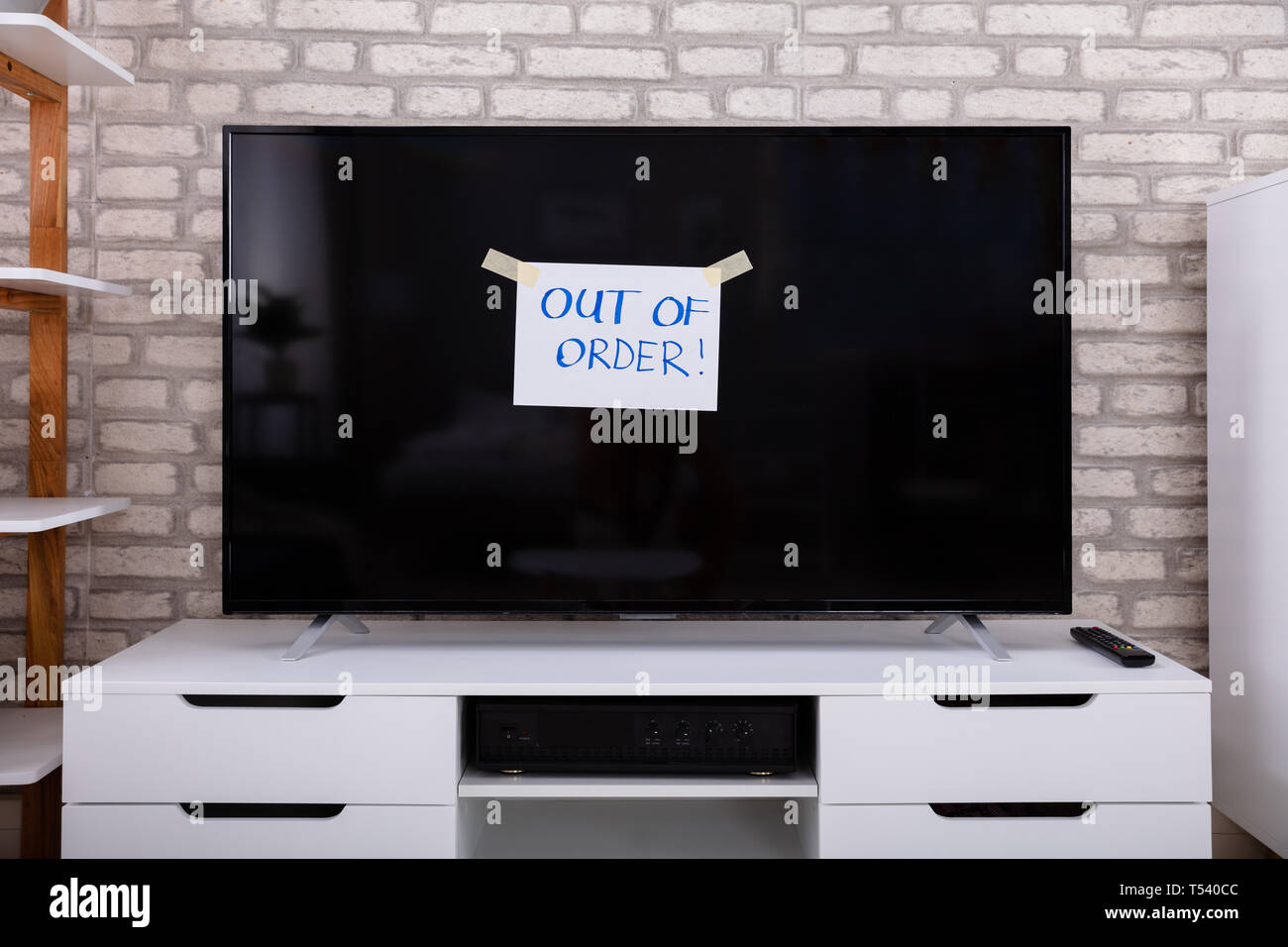 Out Of Order Text On Blank Screen Television In Living Room Stock Photo ...