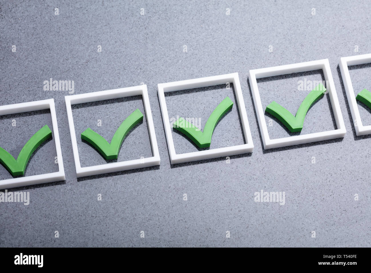 An Overhead View Of Green Check Marks Sign Arranged White Blocks ...