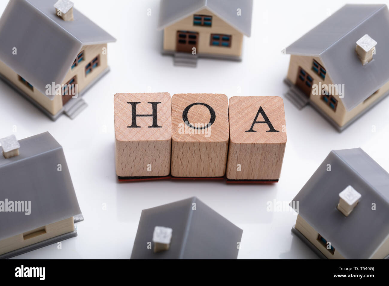 House Models Around HOA Cubic Blocks Over Reflective Desk Stock Photo ...