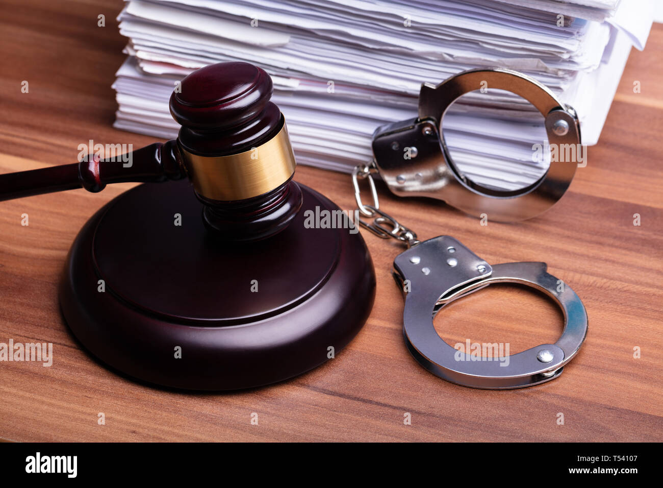 Judge gavel handcuffs on documents hi-res stock photography and images ...