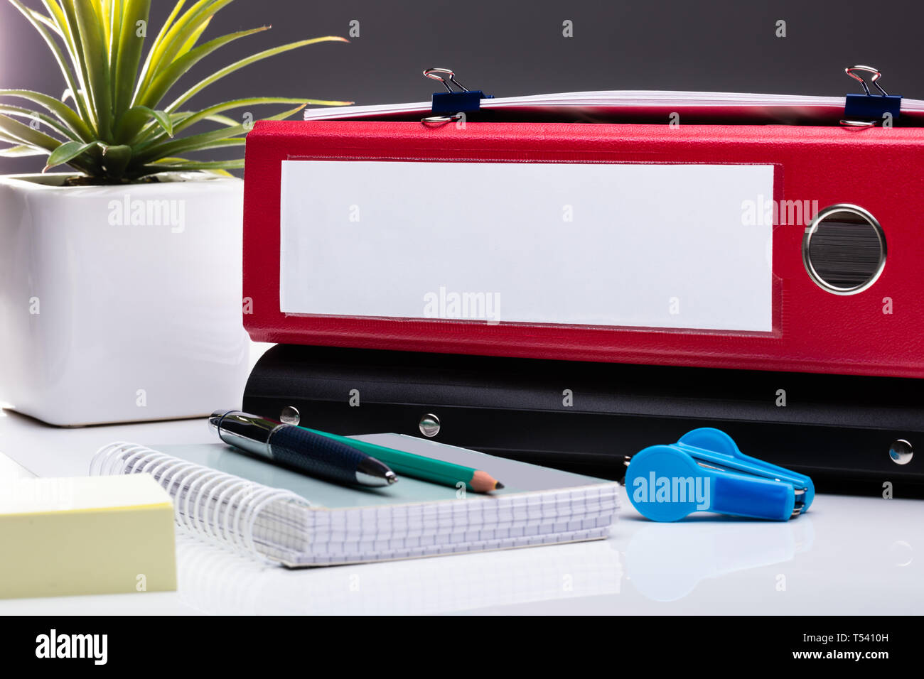 Office Workplace With Laptop And Folders On White Table Stock Photo - Alamy