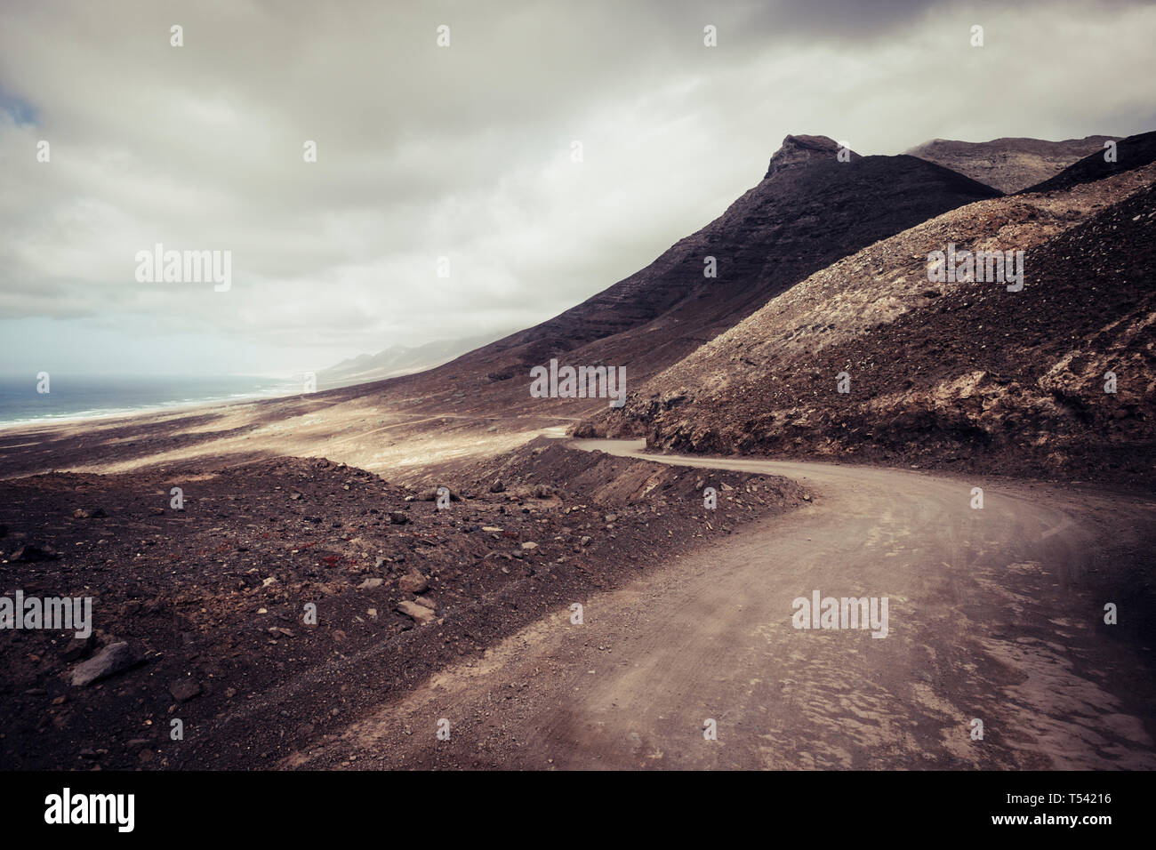 Off road adventure road in the mountains with beach view in wild scenic ...