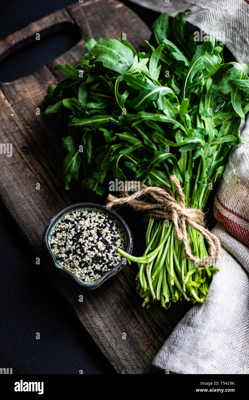 Organic food concept with fresh rocket herb and sesame seeds Stock ...