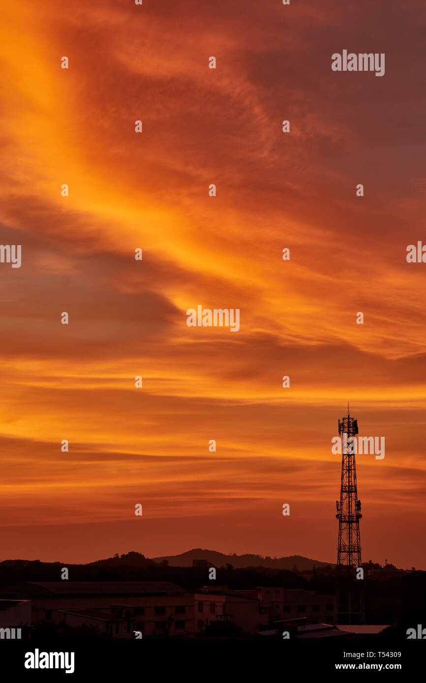 Silhouette signal antenna tower at beautiful sunrise sky background ...