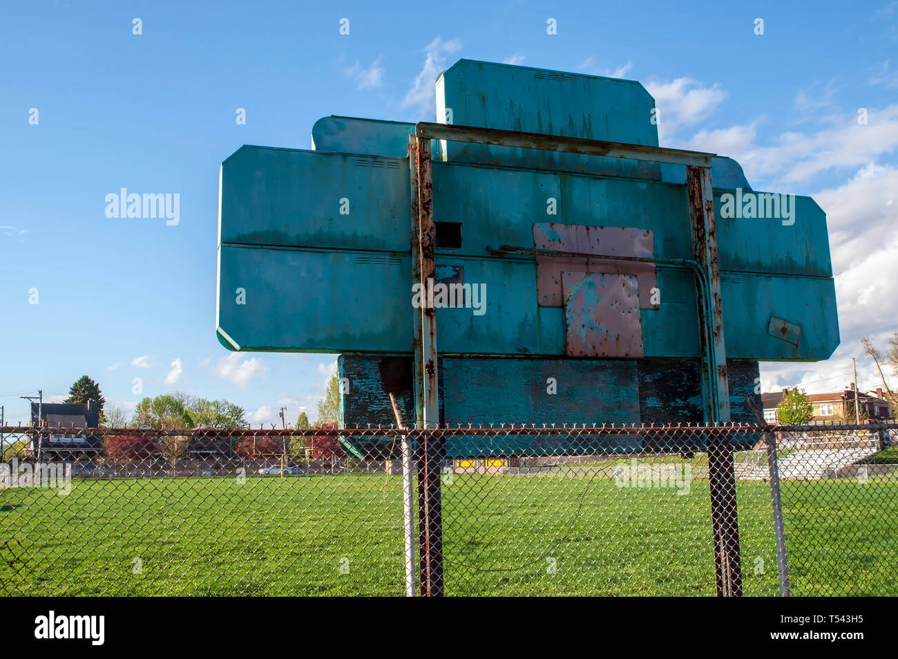 The scoreboard and the football field at Dickson school on a spring day ...