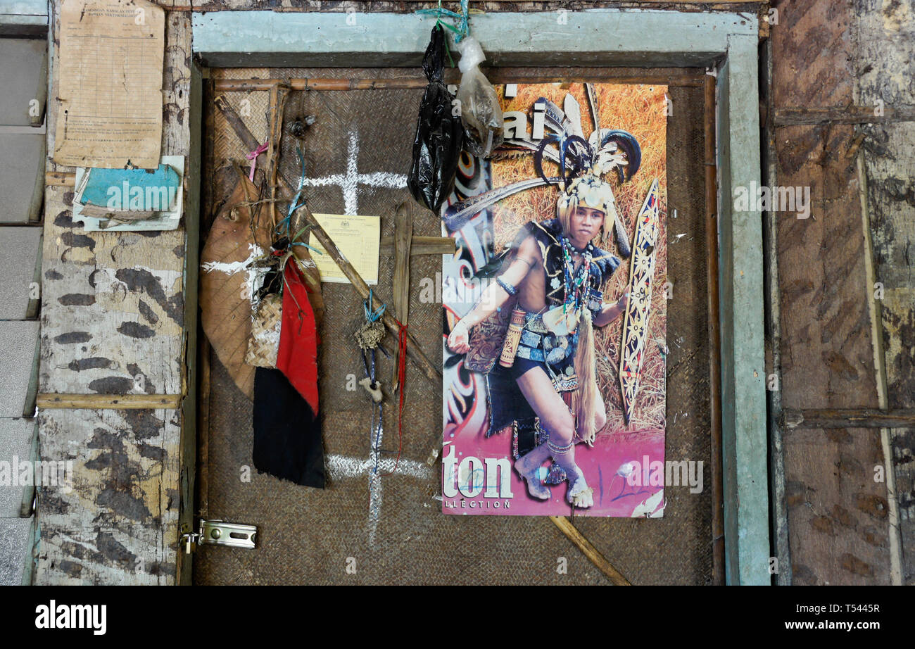Poster and other items decorating an Iban family's door at Mengkak ...