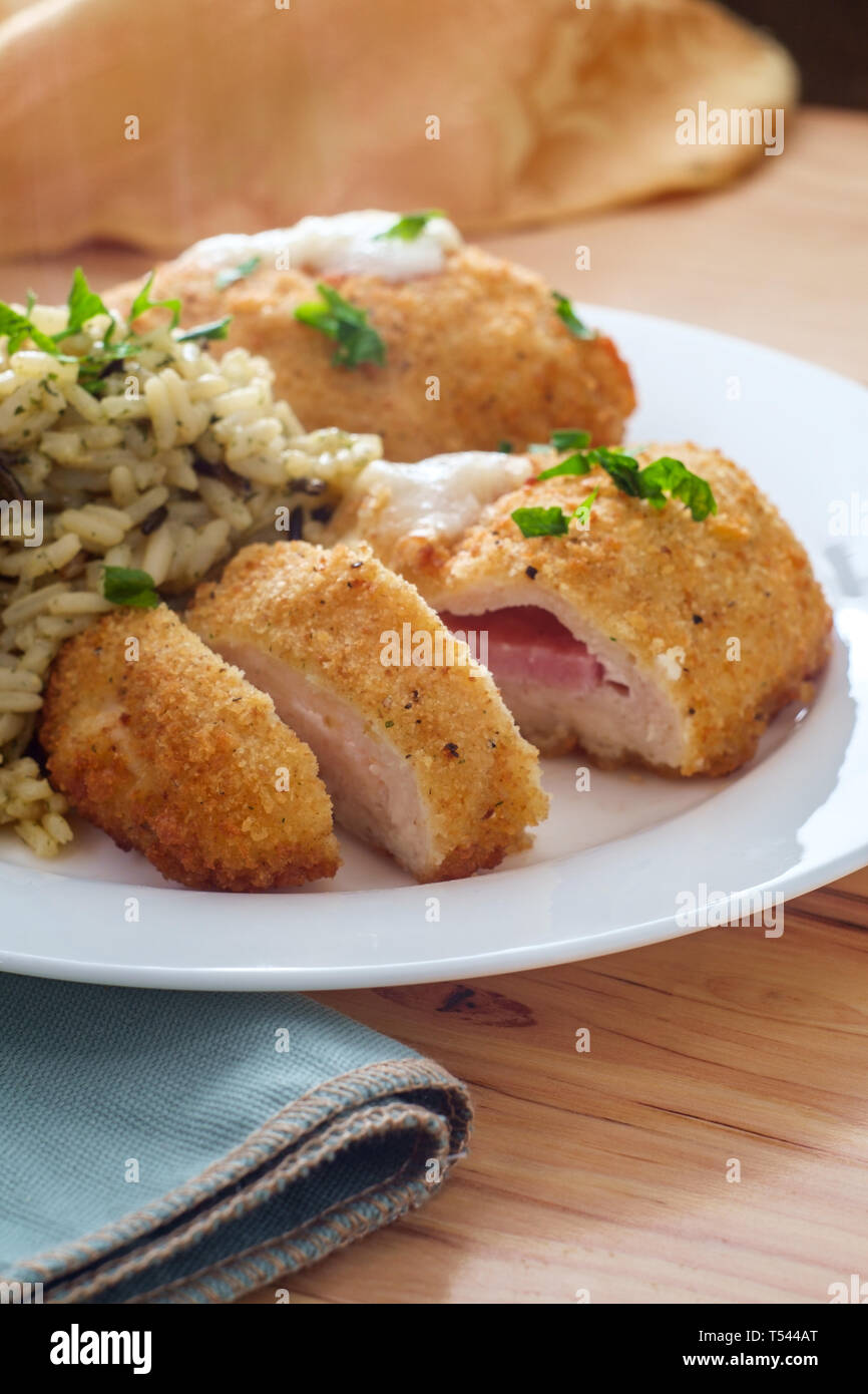 Chicken cordon bleu served with herbed long grain wild rice mix Stock ...