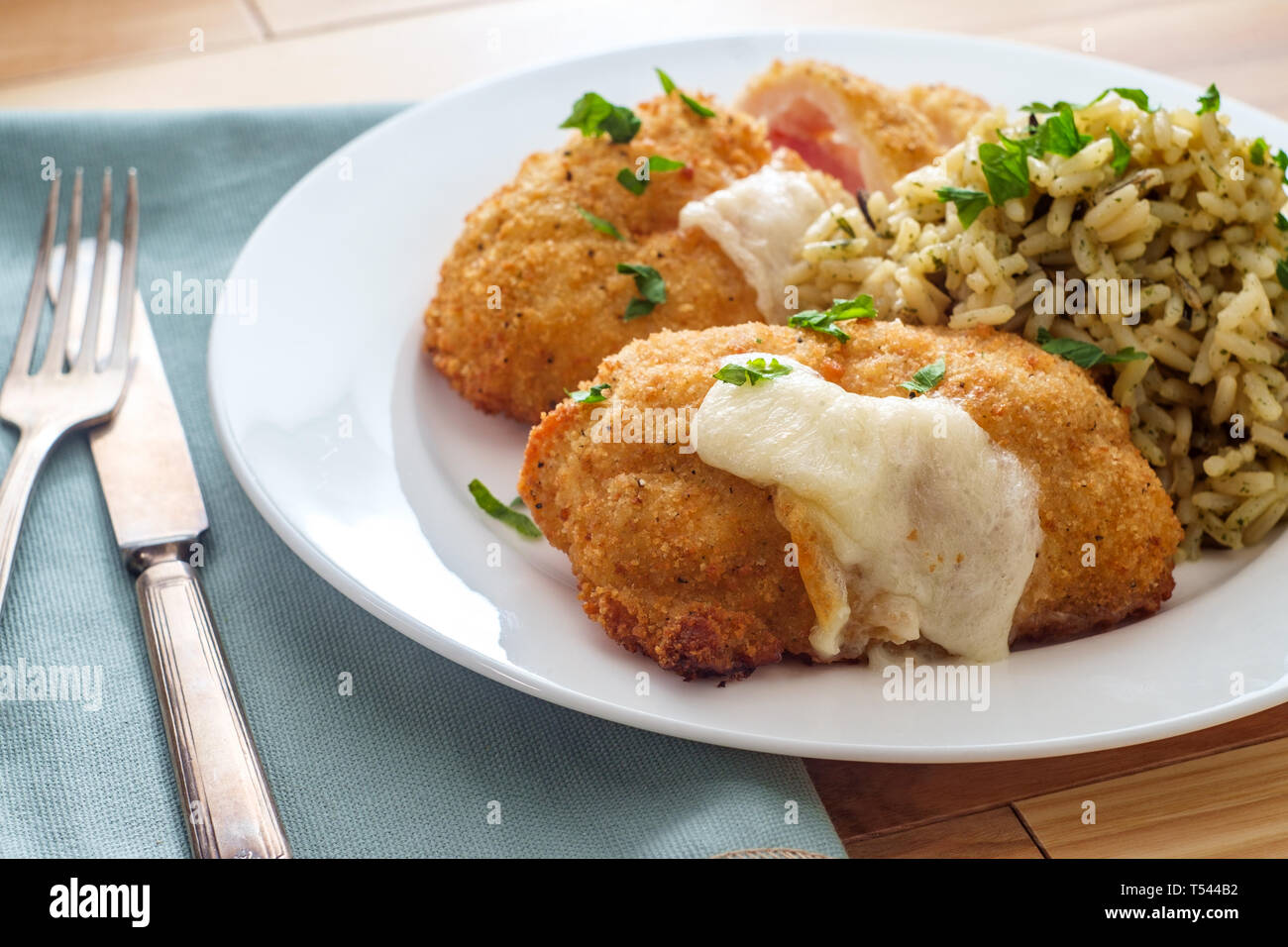 Chicken cordon bleu served with herbed long grain wild rice mix Stock ...