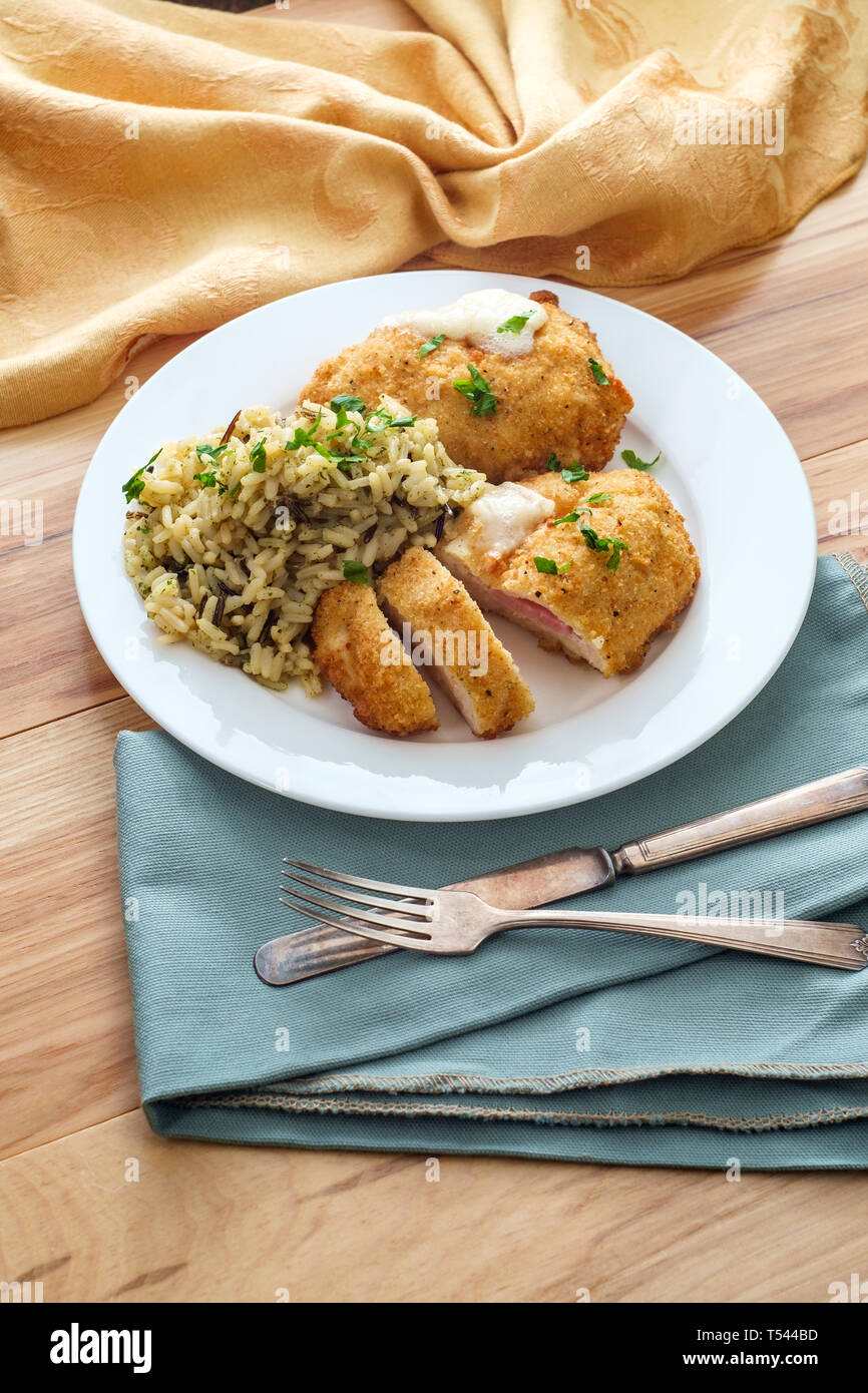 Chicken cordon bleu served with herbed long grain wild rice mix Stock ...