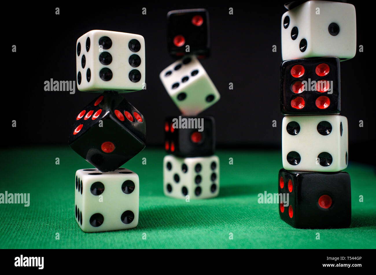 Stacked dice on green billiards table gambling addiction concept Stock ...