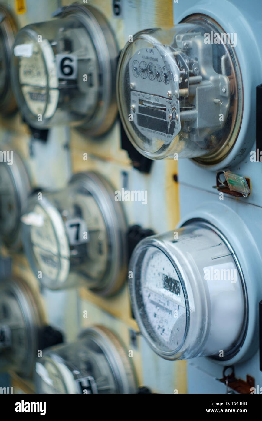 Electric meters measuring usage outside apartment building Stock Photo ...