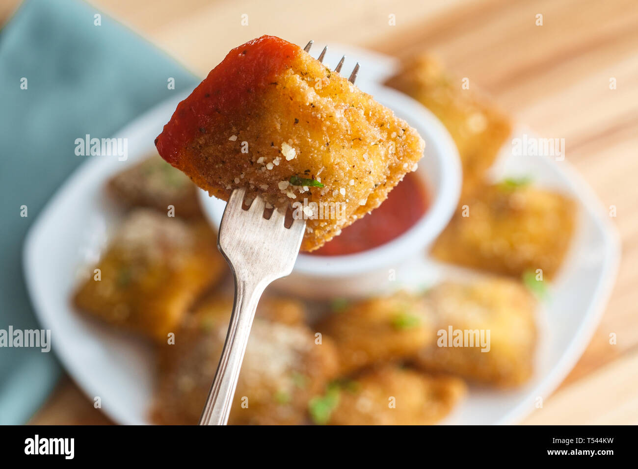 Breaded fried Italian ravioli with hot marinara tomato dipping sauce ...